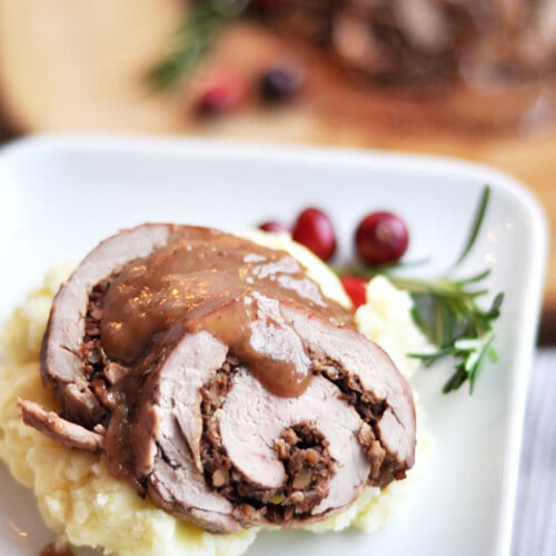 Cranberry Walnut Bacon Stuffed Pork Roll with Brandy Sauce - Mighty Mrs ...